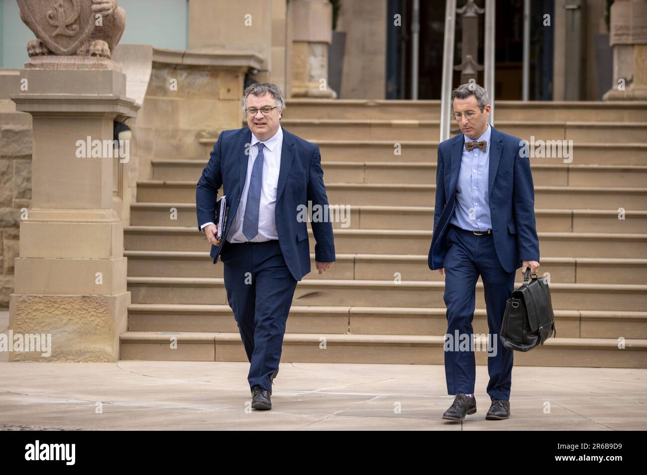 Alliance Party's Stephen Farry (left) with party colleague Andrew Muir ...