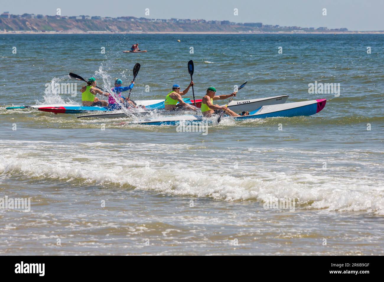 Young men in a surf ski surfski, the Surf Life Saving GB GBR Beach ...