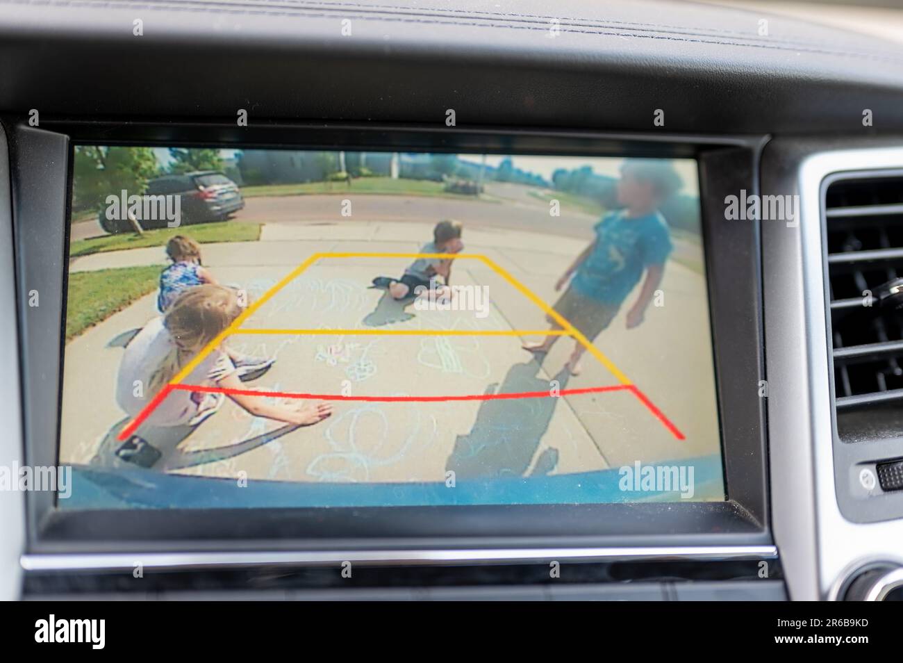 Children seen in a rear view backup camera drawing with chalk Stock ...