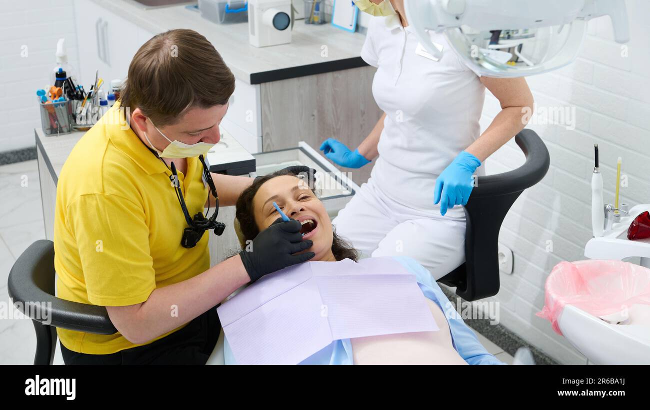 Female pregnant patient, gravid woman getting dental examination in ...
