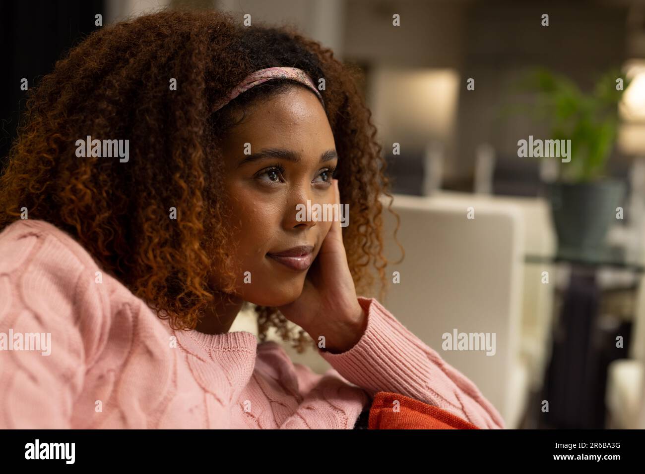 Thoughtful biracial woman hi-res stock photography and images - Alamy