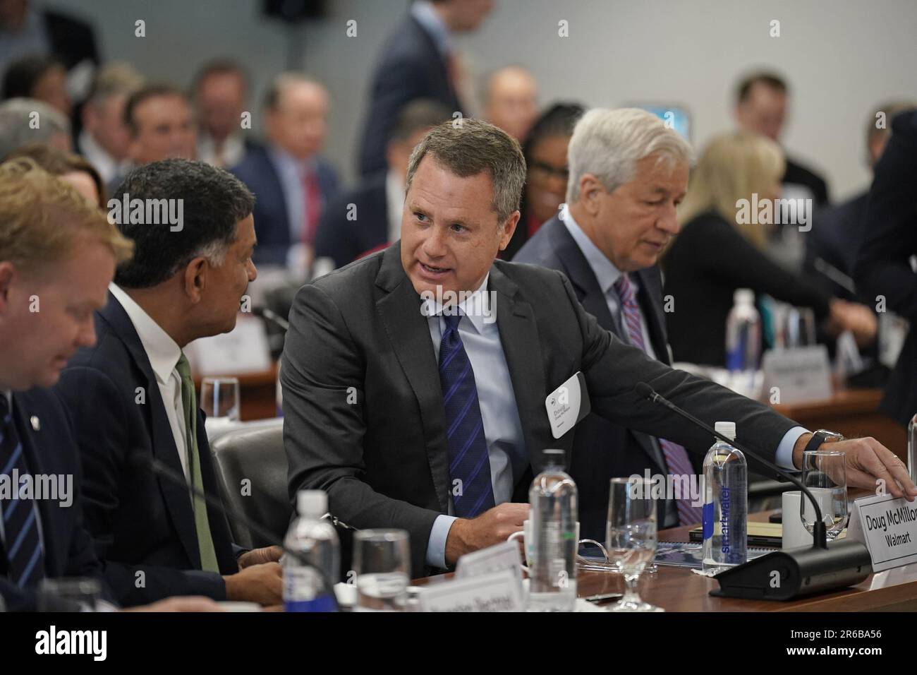 Doug McMillon (centre), Chief Executive Officer of Walmart, during an ...