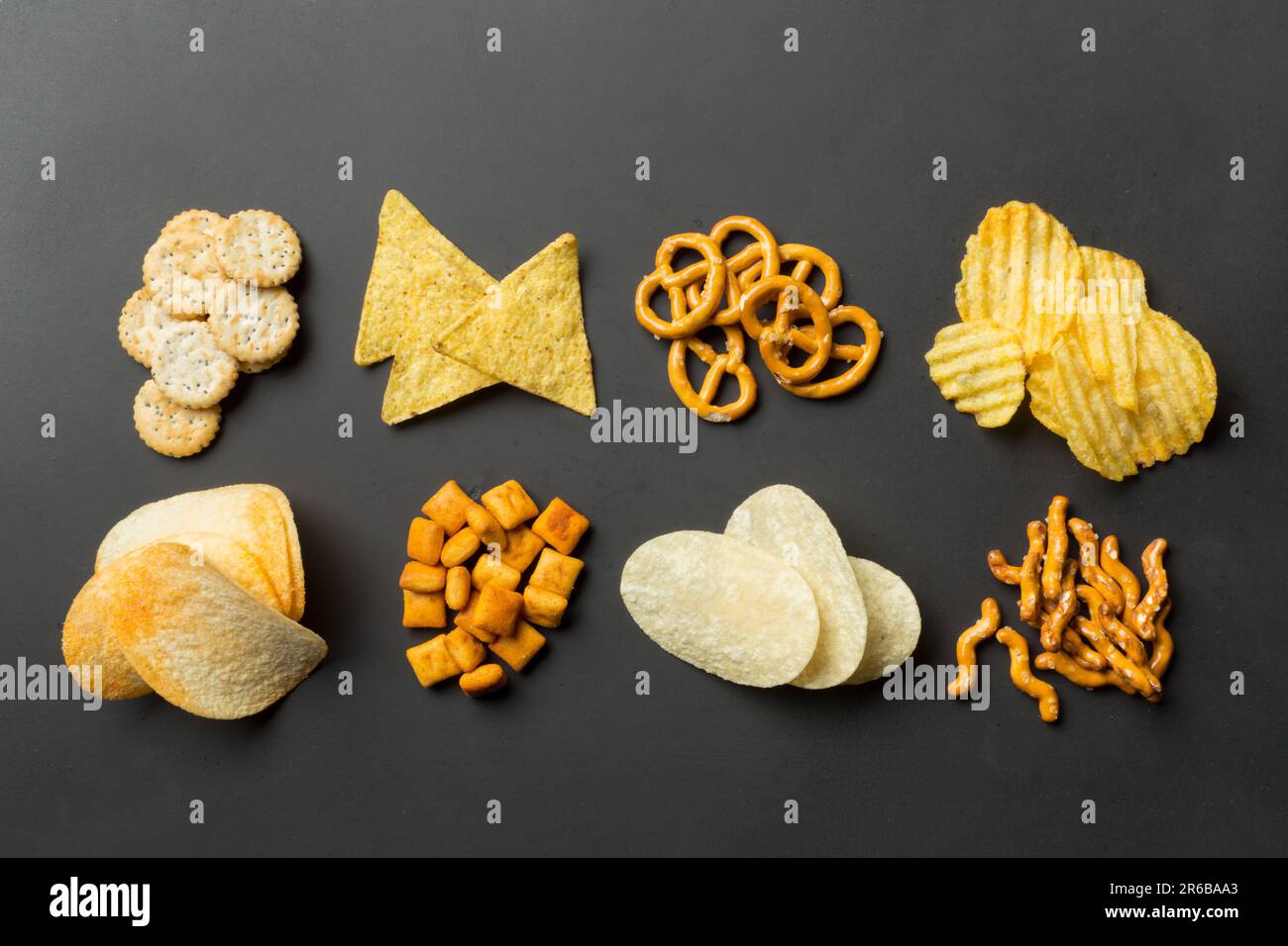 Salty snacks. Pretzels, chips, crackers Stock Photo - Alamy