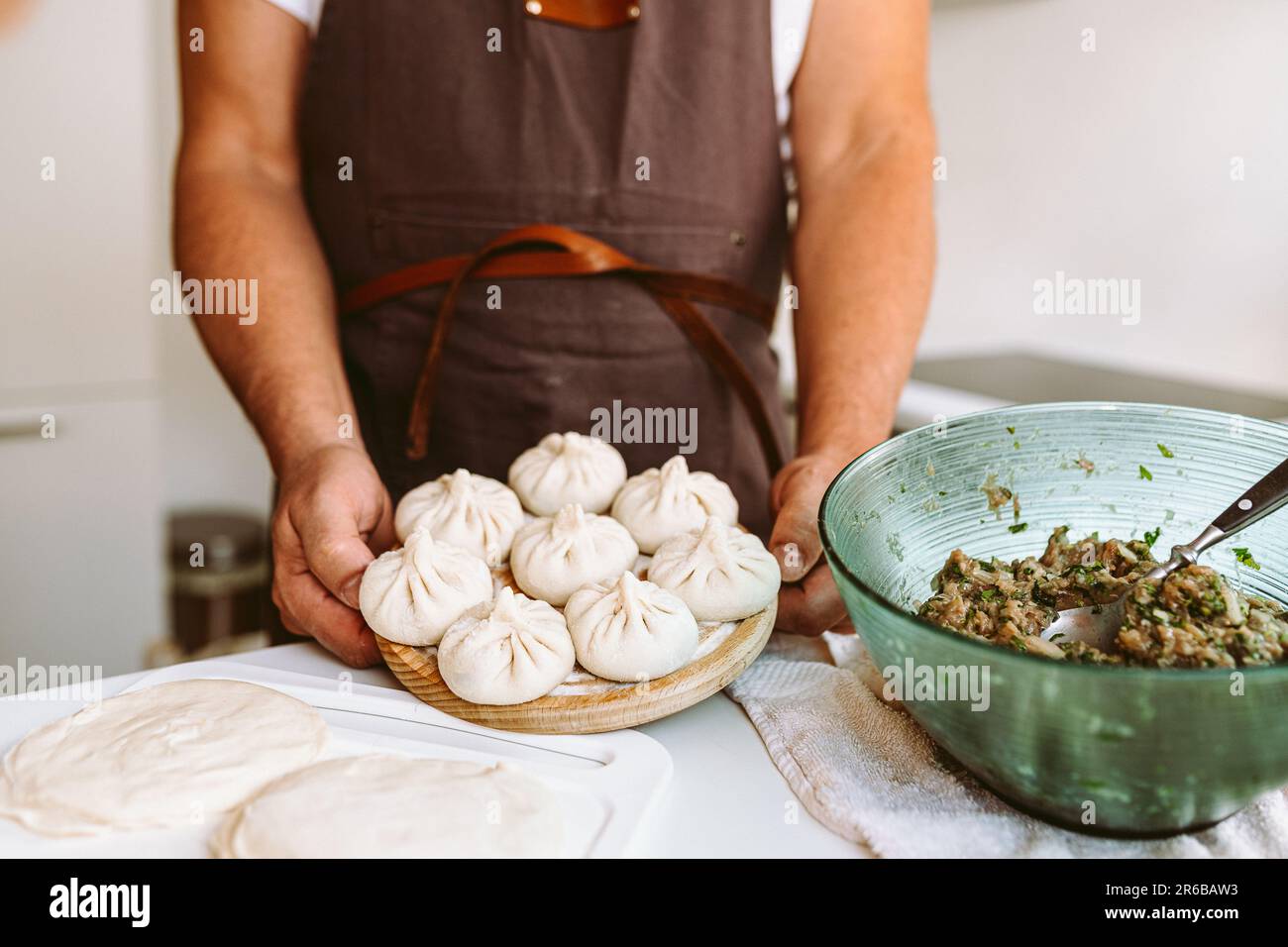portrait unrecognizable male chef with cooked khinkali Stock Photo - Alamy