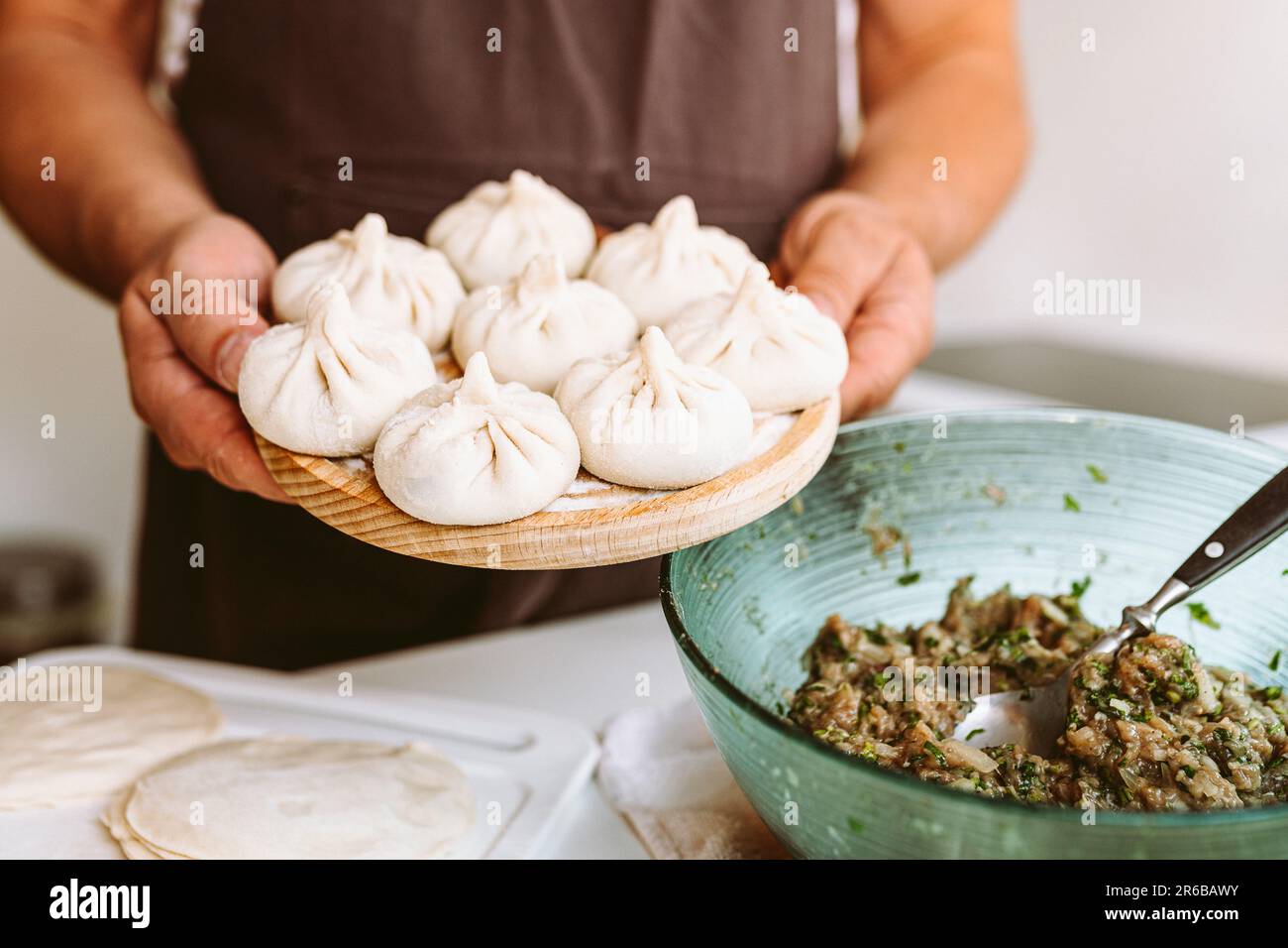portrait unrecognizable male chef with cooked khinkali Stock Photo - Alamy