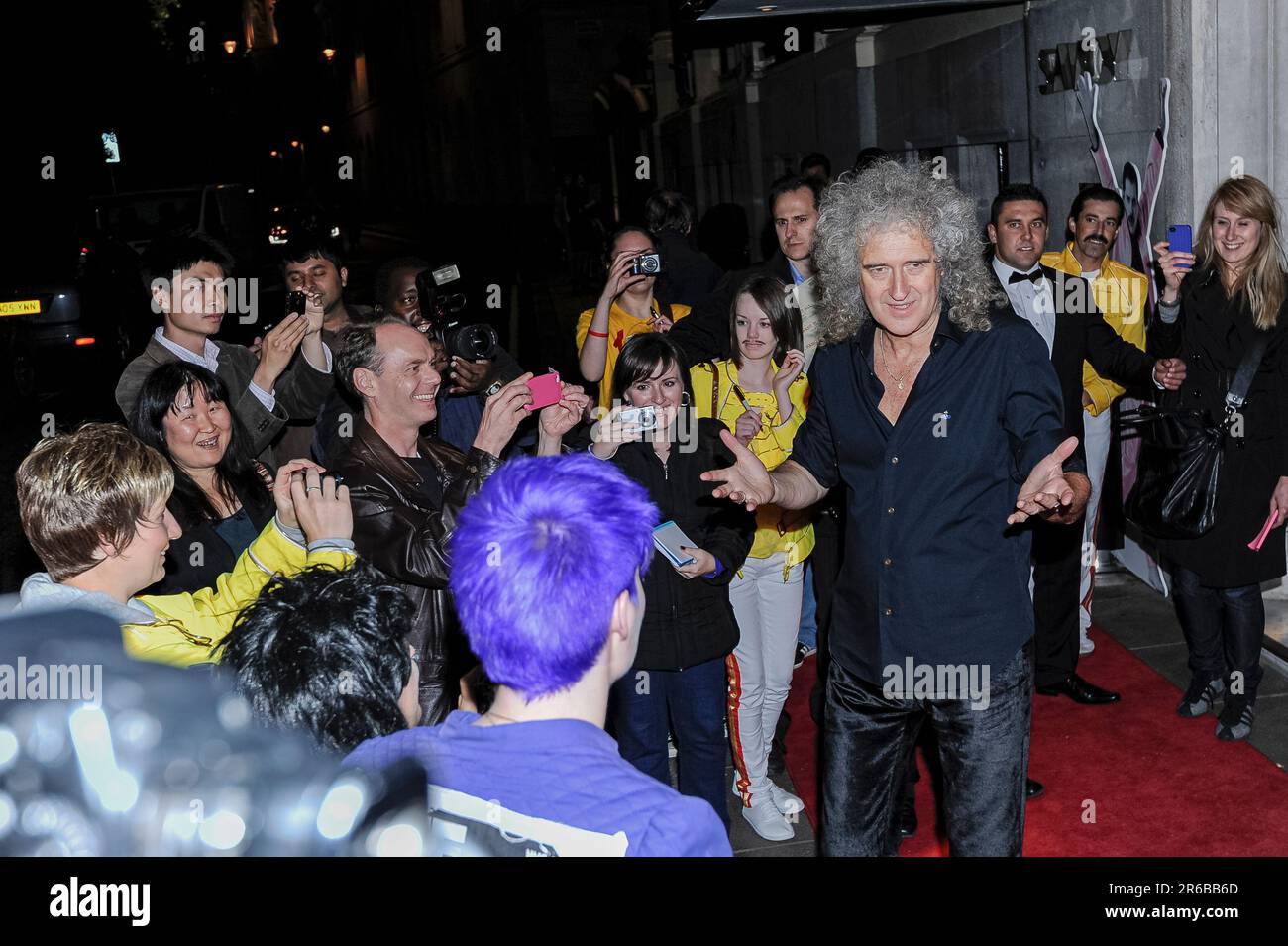 Queen guitarist Brian May greets fans outside a London hotel. Credit ...