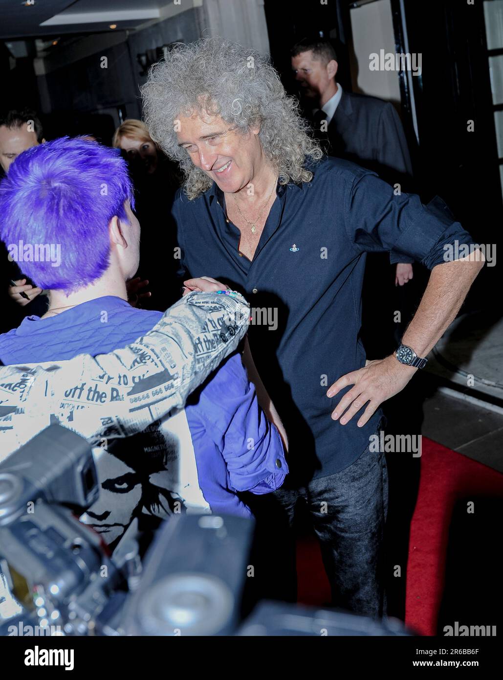 Queen guitarist Brian May greets fans outside a London hotel. Credit ...