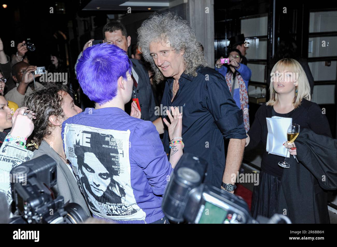 Queen guitarist Brian May greets fans outside a London hotel. Credit ...