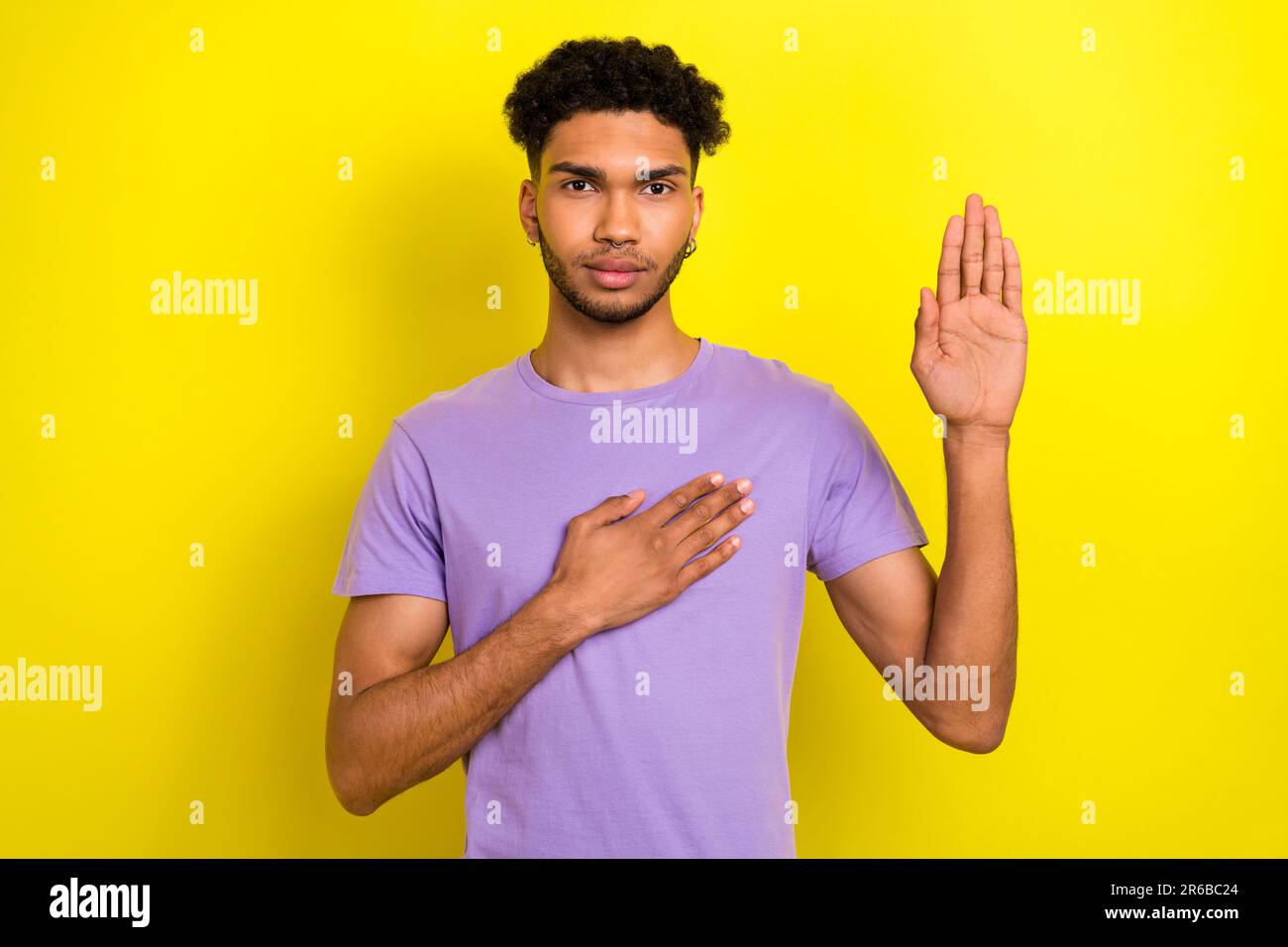 Photo of candid focused concentrated person arm touch heart raise palm ...