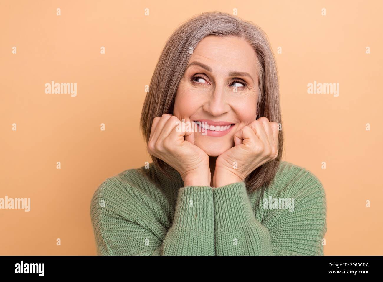 Photo of pretty positive minded person arms touch cheeks beaming smile ...