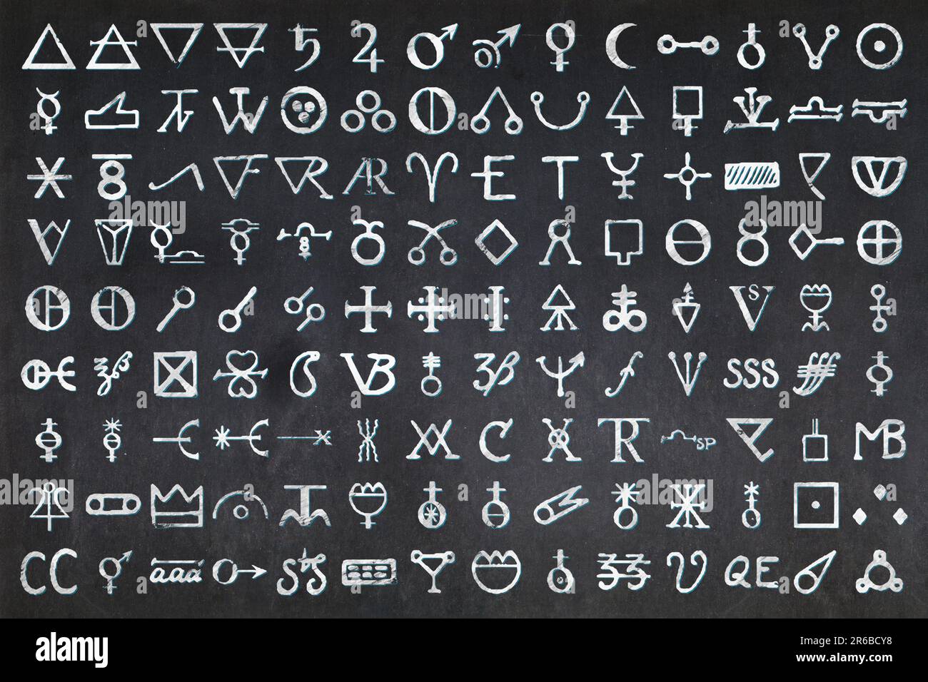 Blackboard with over hundred glyphs used in alchemy drawn in the middle ...