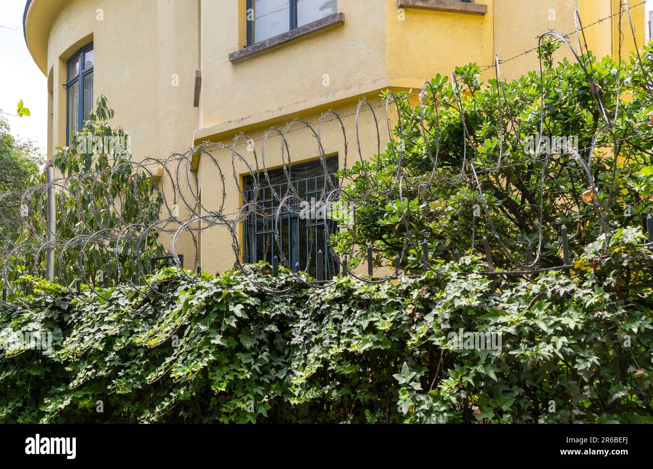 Razor wire fencing security fence on property wall, Condesa, Mexico ...
