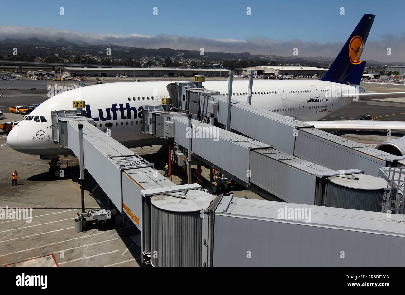 Three jetways are used to off-load passengers of a Lufthansa Airbus A380 super jumbo jet, the ...