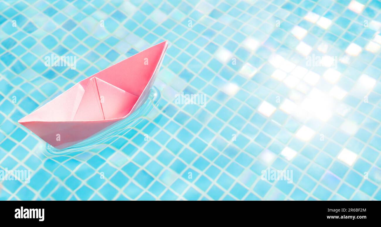 Voyage. Floating pink paper boat water pool abstract ship symbol. Blue ...