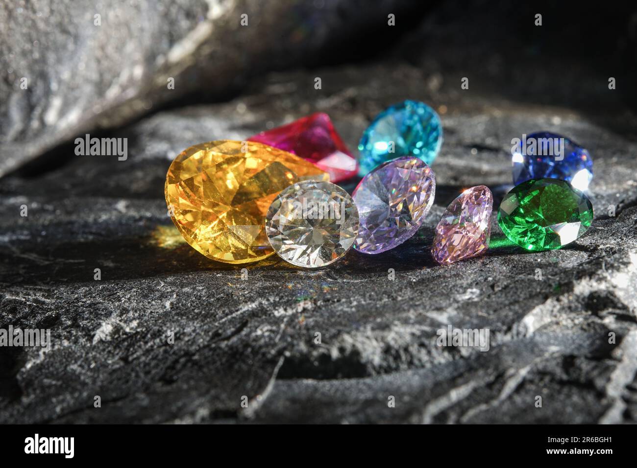 The glimmering natural colorful sapphire gemstones on a rugged rock ...