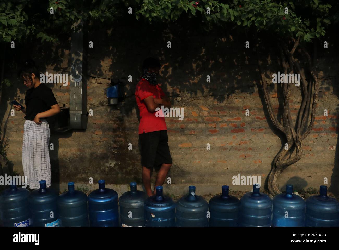 On June 8, 2023, in Bhaktapur, Nepal. General public with their water ...
