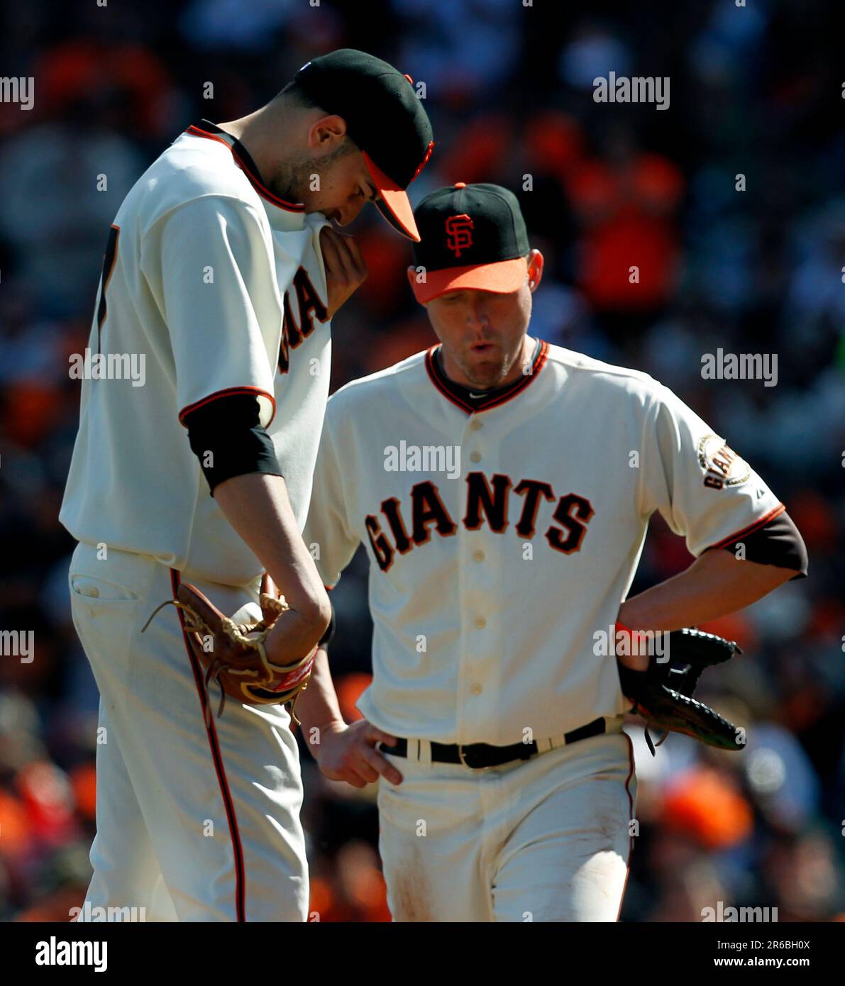 Jonathan Sanchez and Aubrey Huff meet on the mound before manager Bruce ...