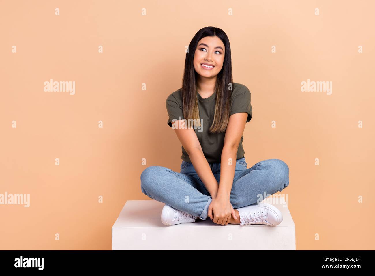 Full body length photo of young japanese model sit comfort podium ...
