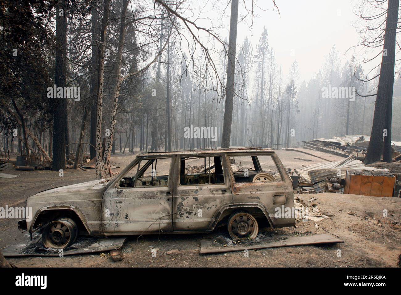 Twisted metal and burned out cars are all that is left in a Concow Road ...