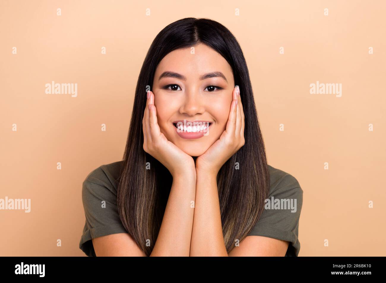 Closeup photo of cute asian girl hold arms hands on cheekbones admire ...