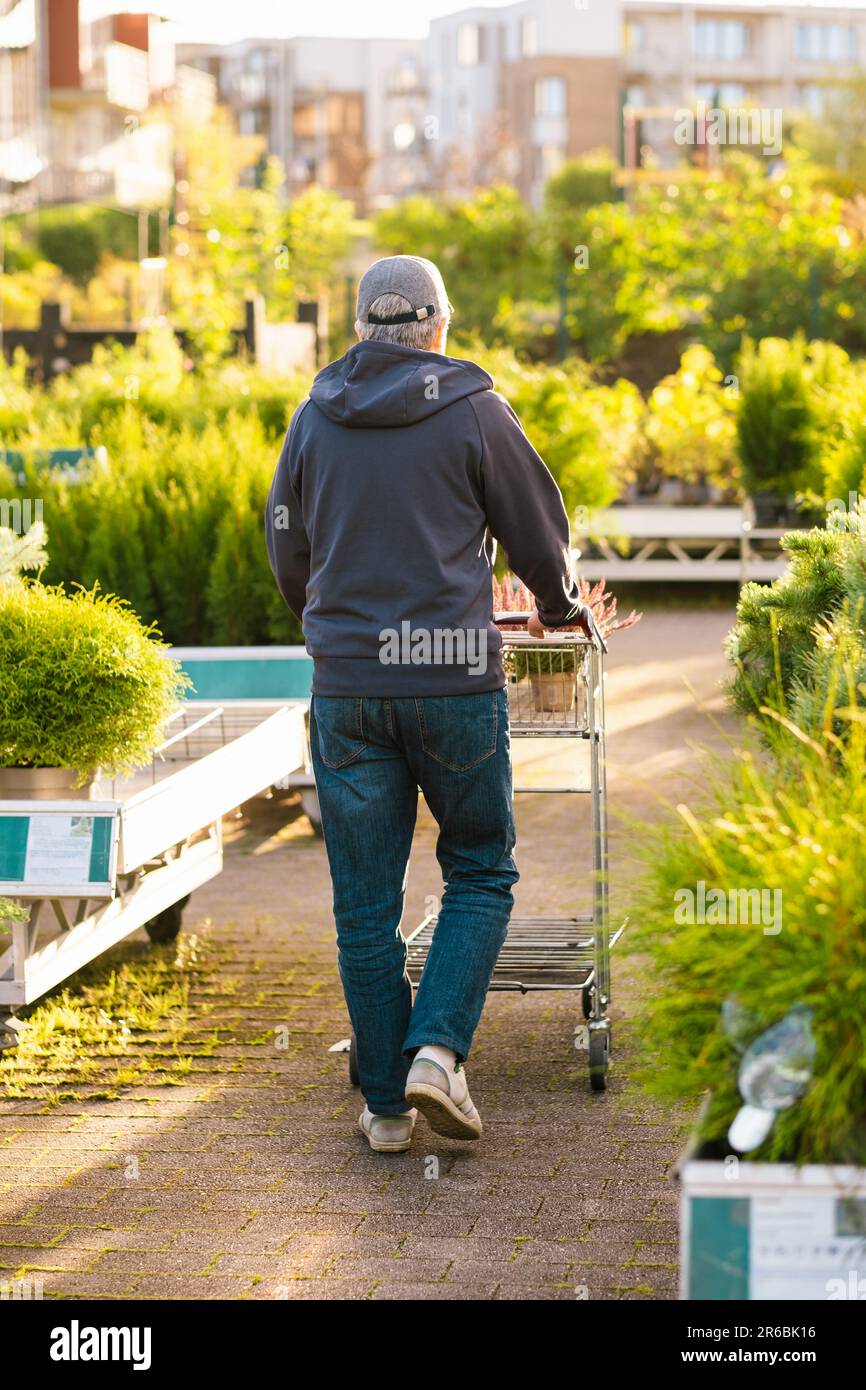 Pushing trolley hi-res stock photography and images - Alamy