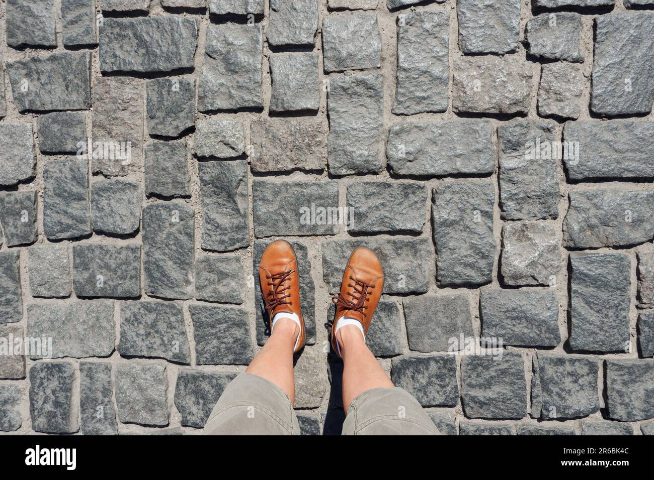 POV feet selfie legs walking street pavement top view. Abstract travel ...