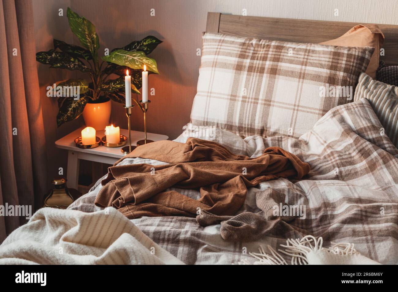 cozy scandinavian bedroom interior in natural tones, real life mess ...