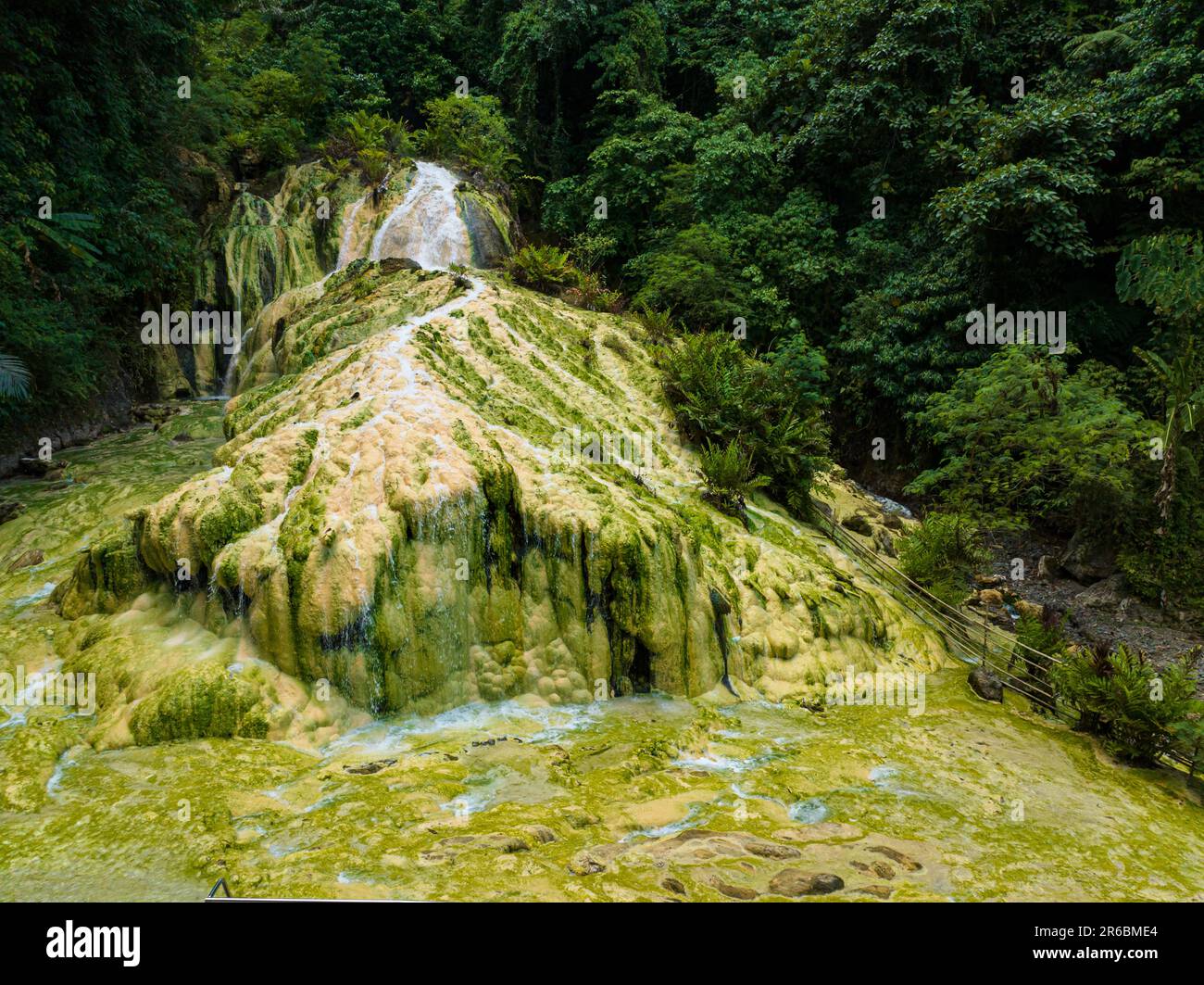 Beautiful hot waterfall in the rainforest. Falls in the tropical ...