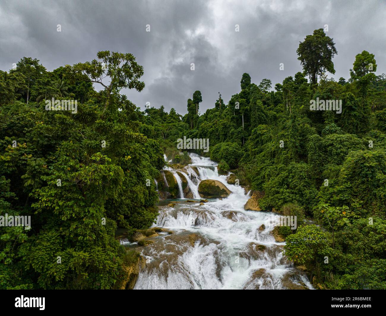Top view of Beautiful waterfall in green forest. Highest Aliwagwag falls in the Philippines ...