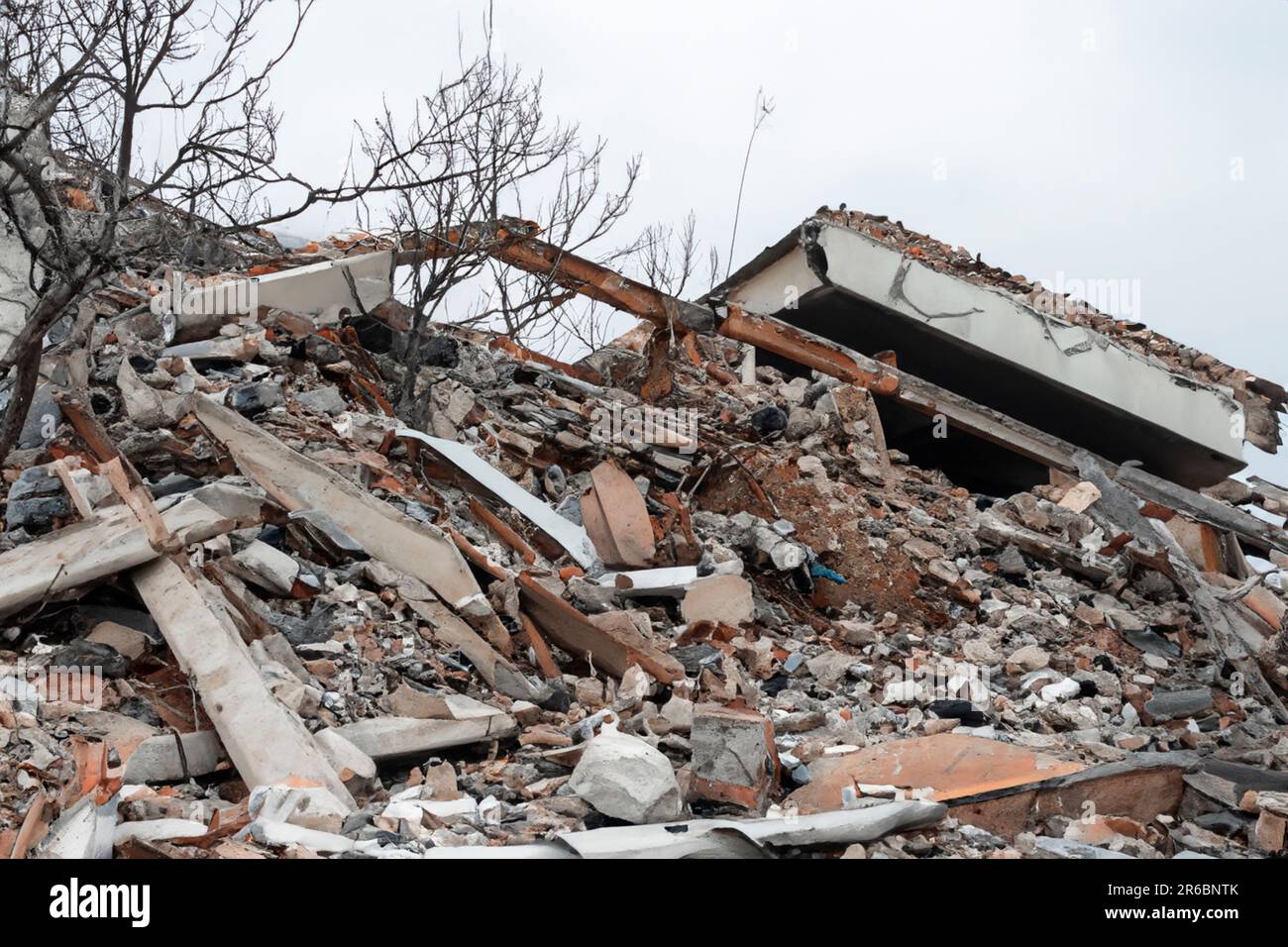 Building collapse. Debris and destroyed building that collapsed from an earthquake. Catastrophe ...