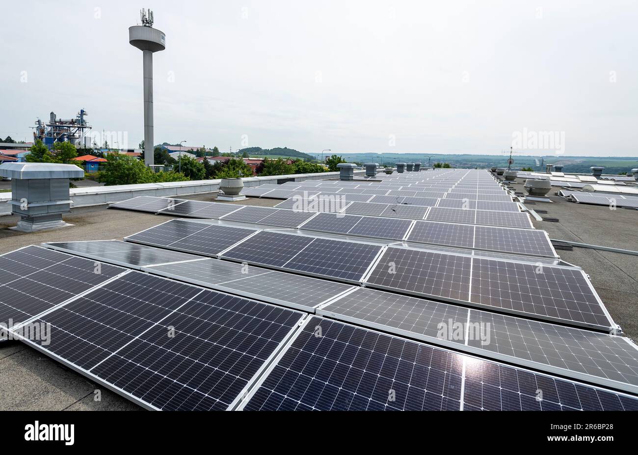 Workers assemble a photovoltaic power plant, whose construction is ...