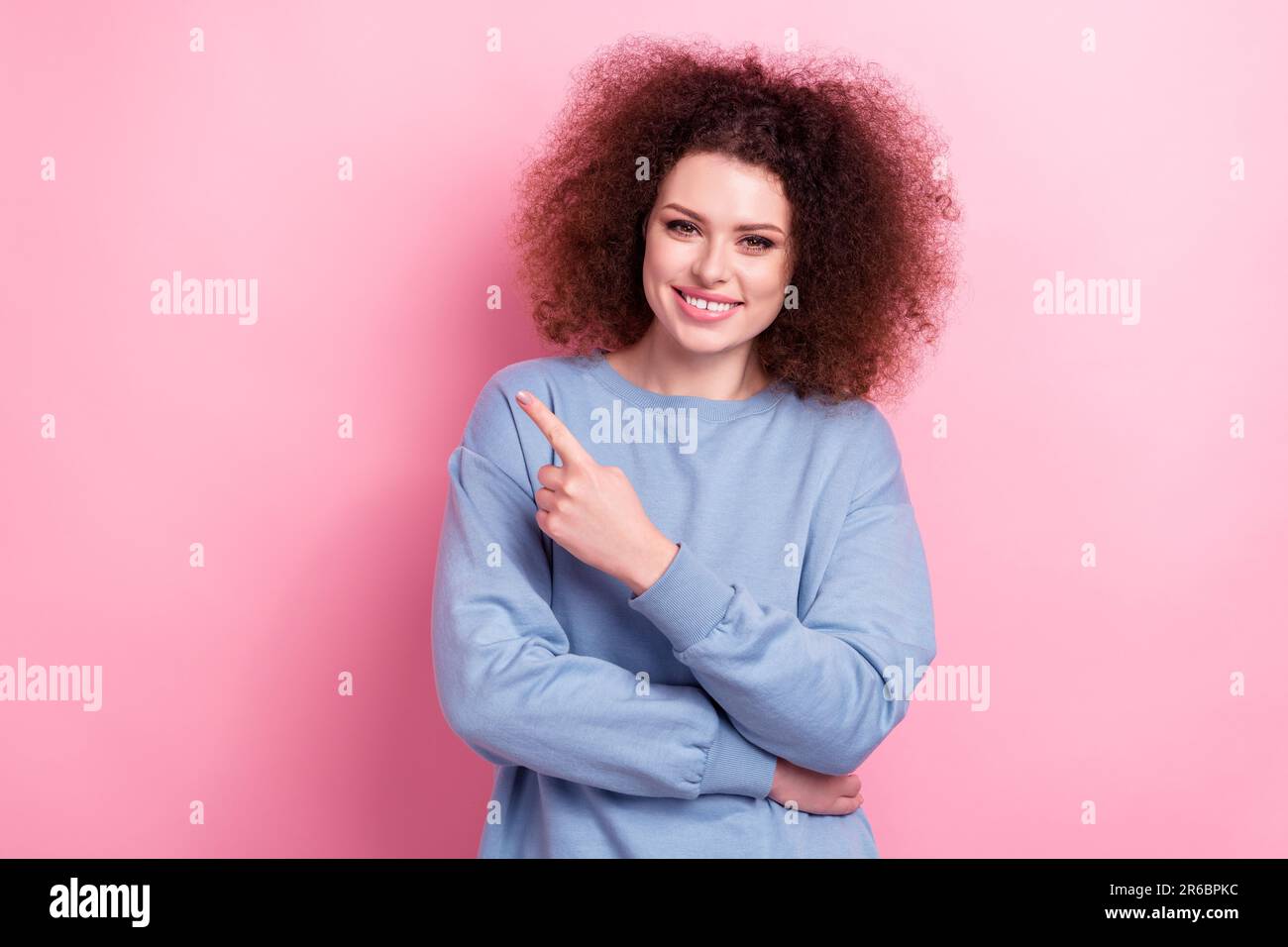Photo of young cheerful girl directing finger mockup new cafeteria ...