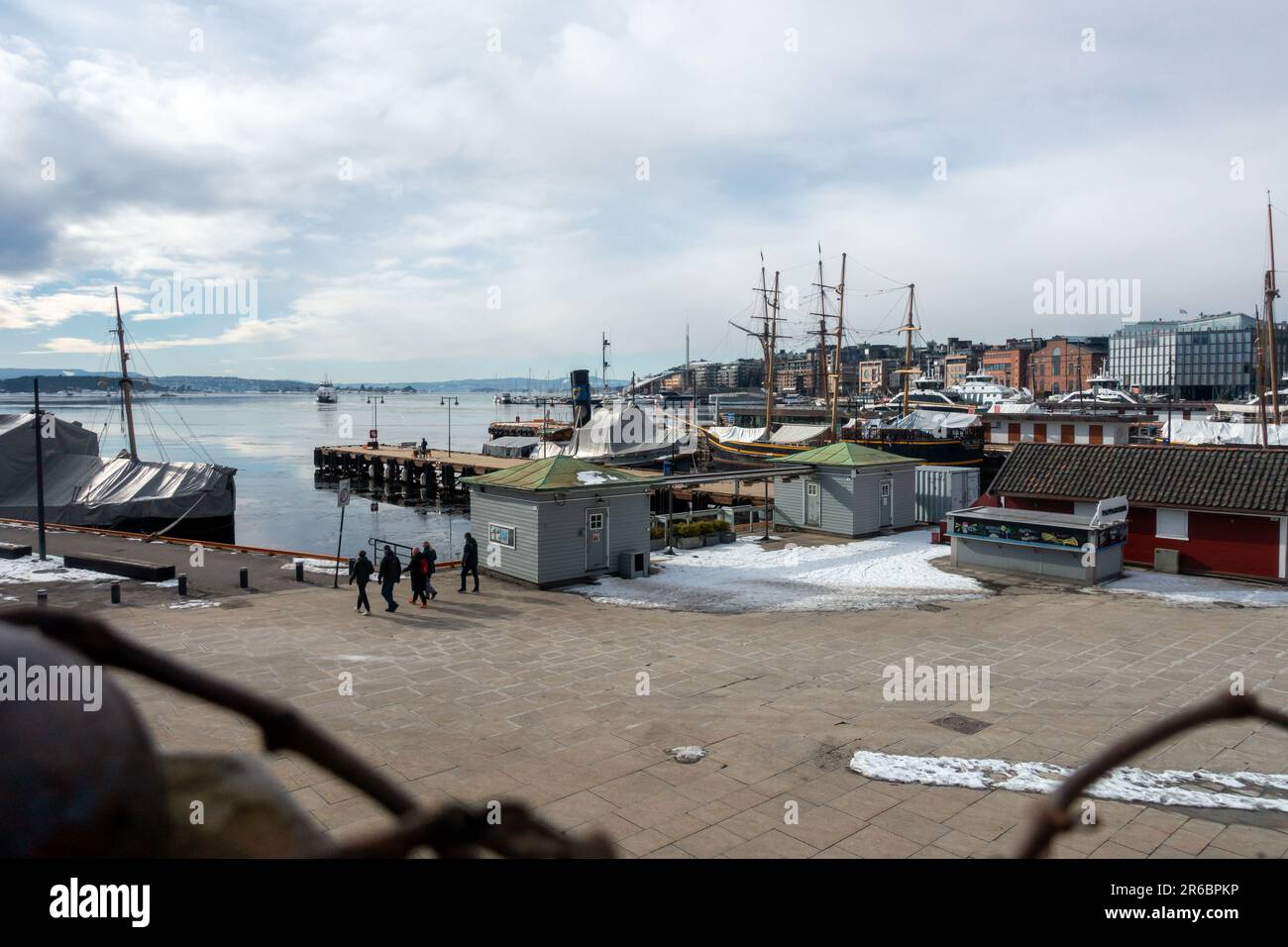 people walking through down town docks of oslo Stock Photo - Alamy