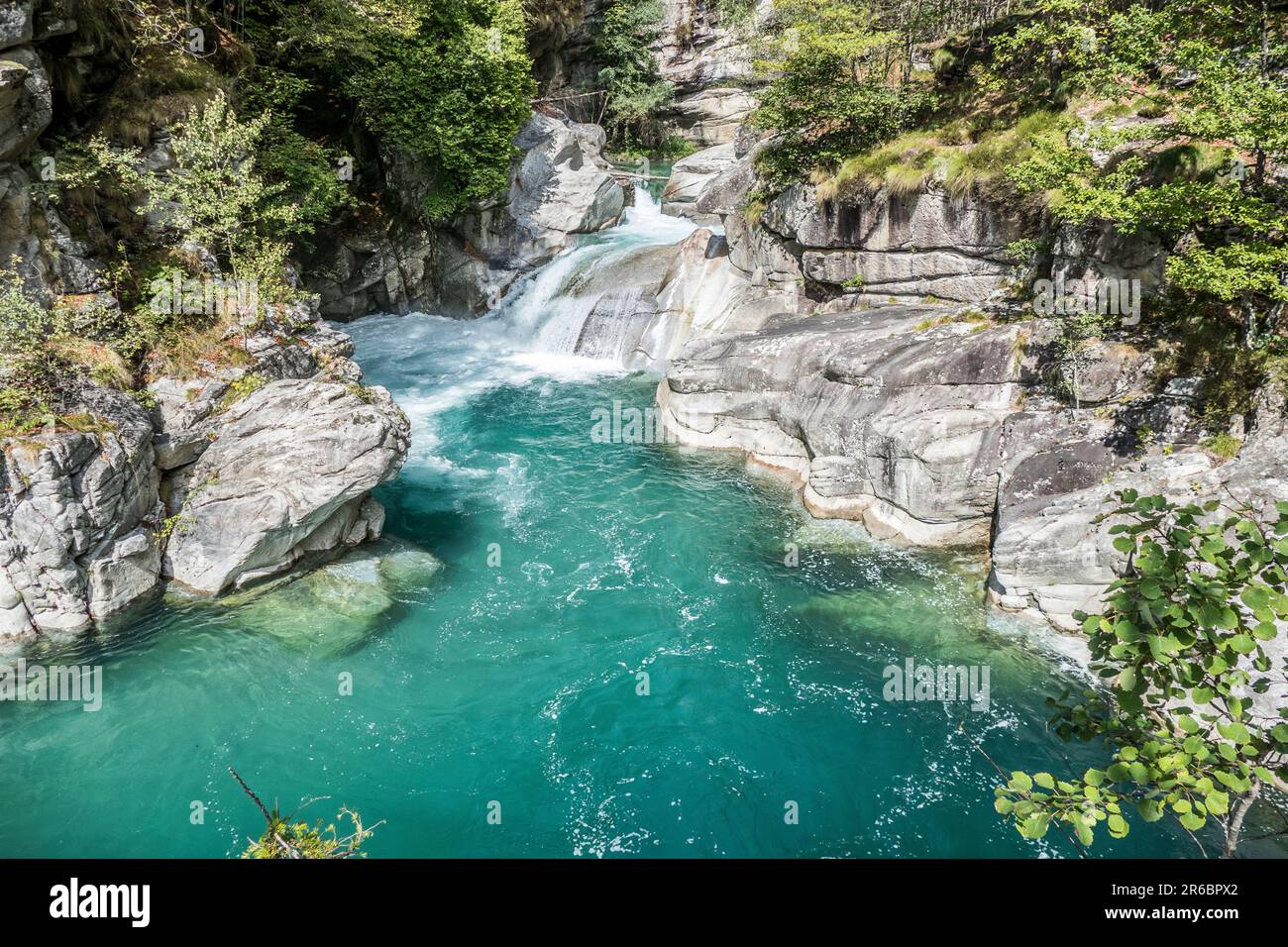The Potholes of the Giants in the Toce River with green water and ...