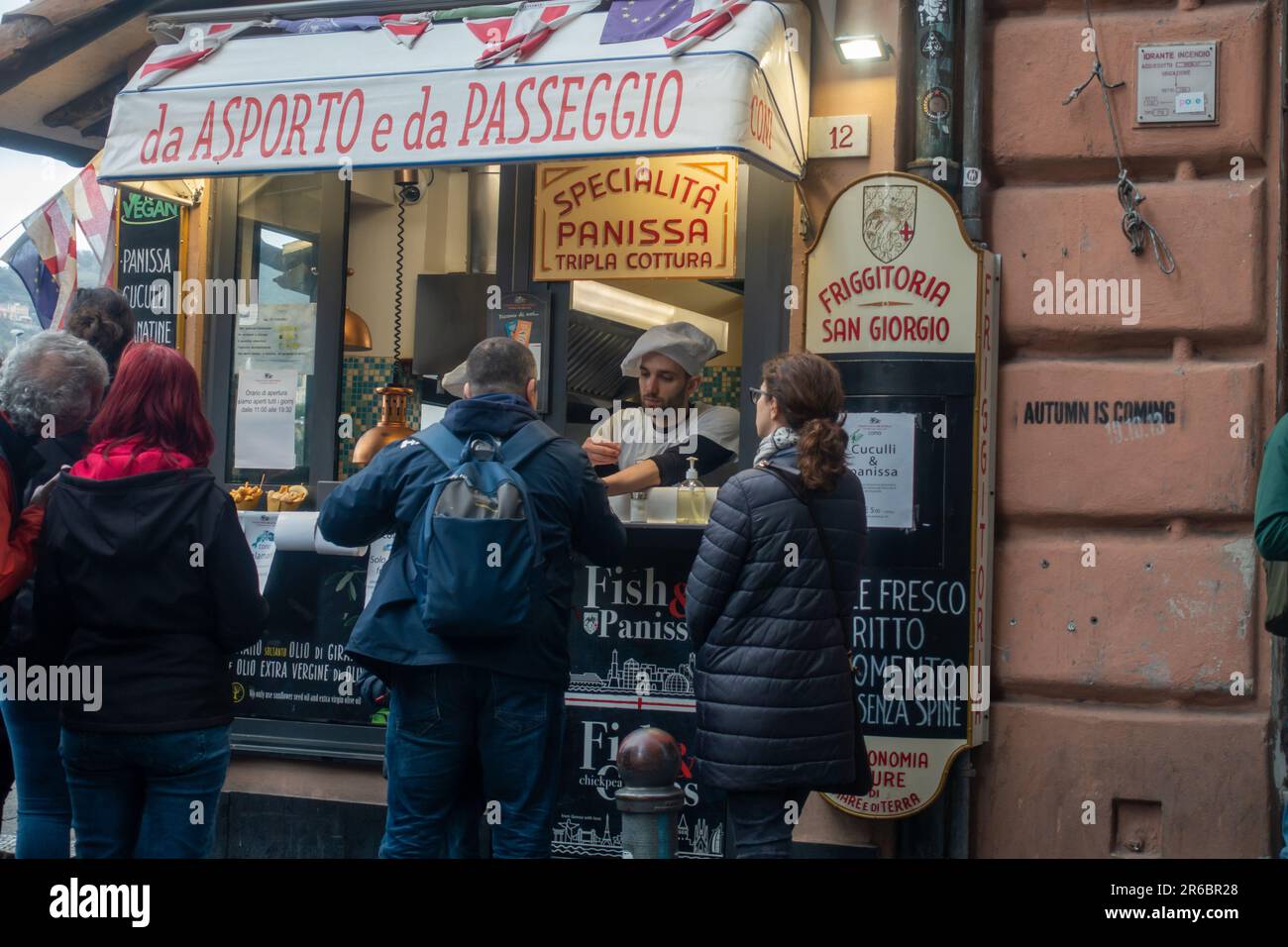 Italian street food vendor serves people in streets of genoa italy ...