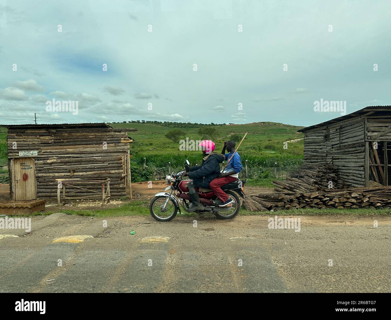 Uganda, Africa - March 25, 2023: Typical roadside scene, with two men ...