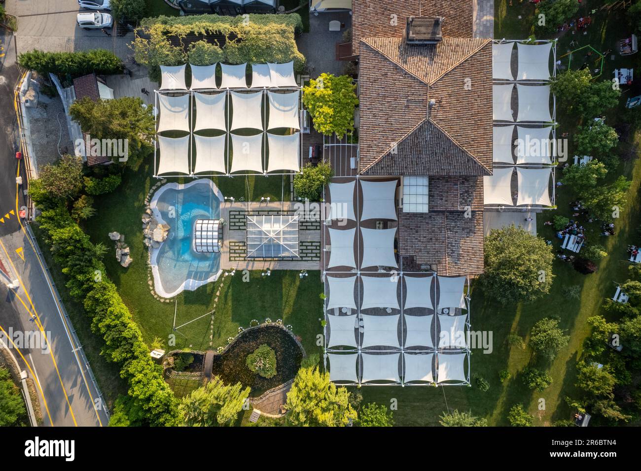 Expensive private villa venue location. Swimming pool in a park. Mansion exterior. Luxury villa ...