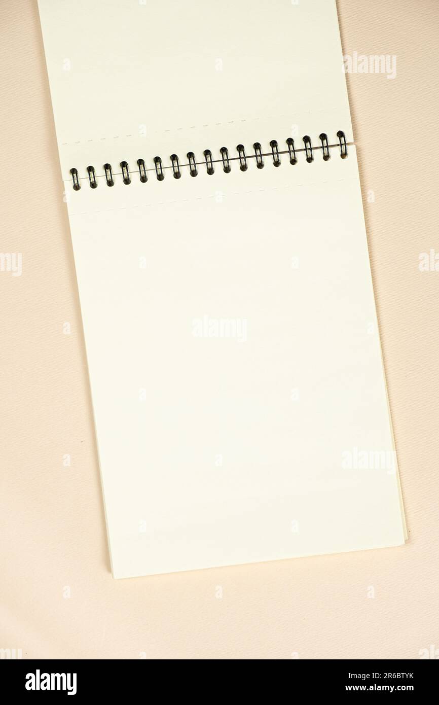 Open notepad on a beige background top view, space for text Stock Photo ...