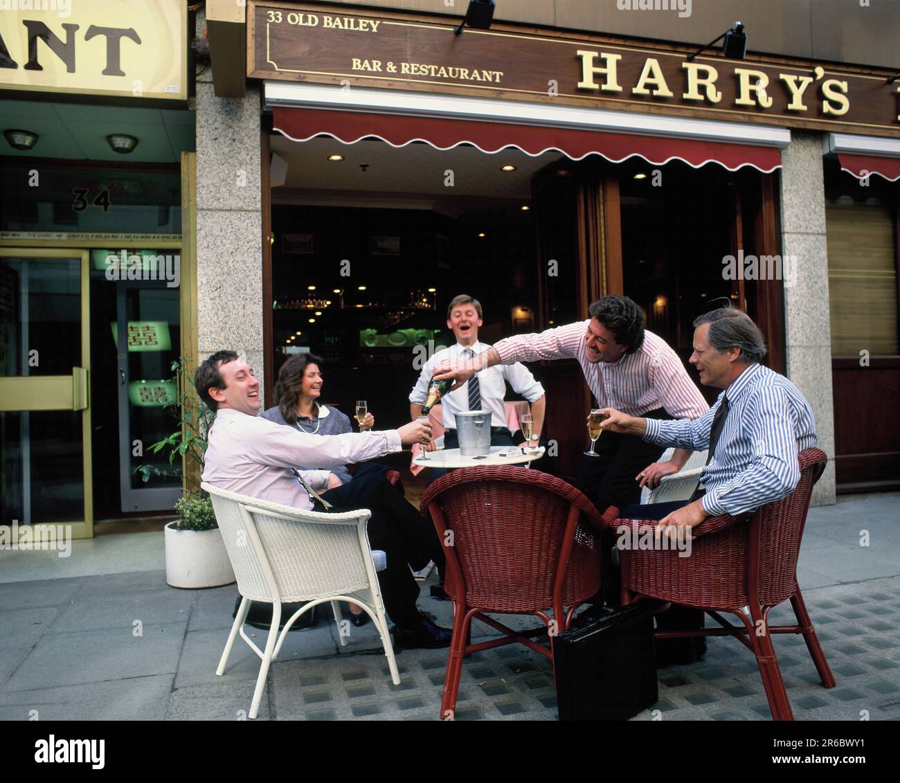 England. London. People drinking Champagne outside Harry's Bar Stock ...