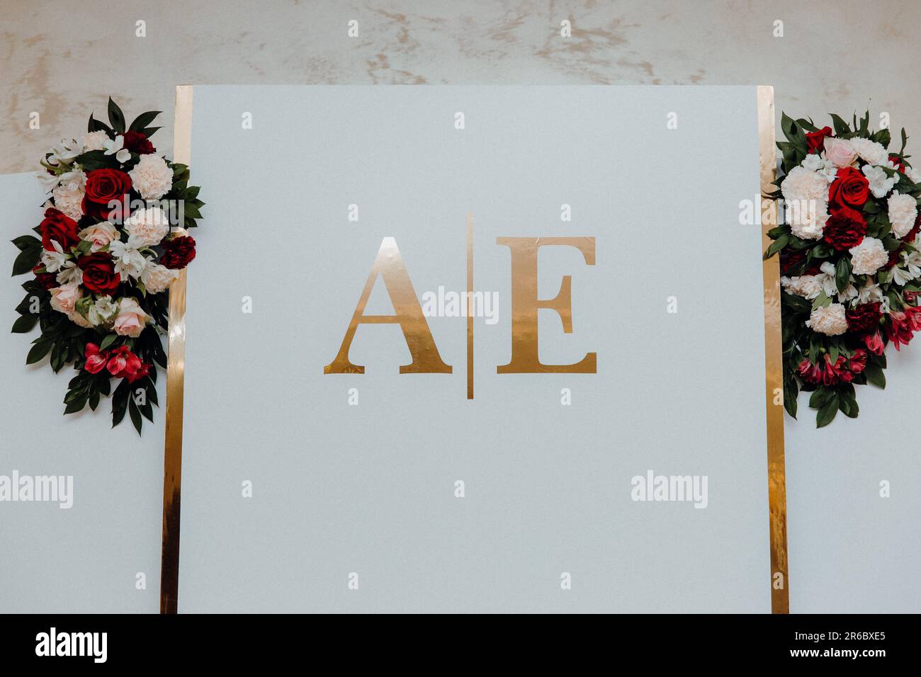 A close-up image of a wall with white painted letters ' initials ...