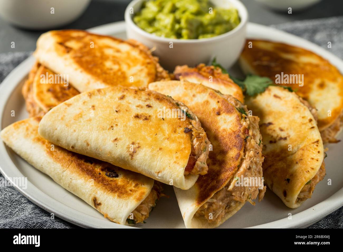 Homemade Mini Chicken Quesadillas with Salsa and Guac Stock Photo - Alamy