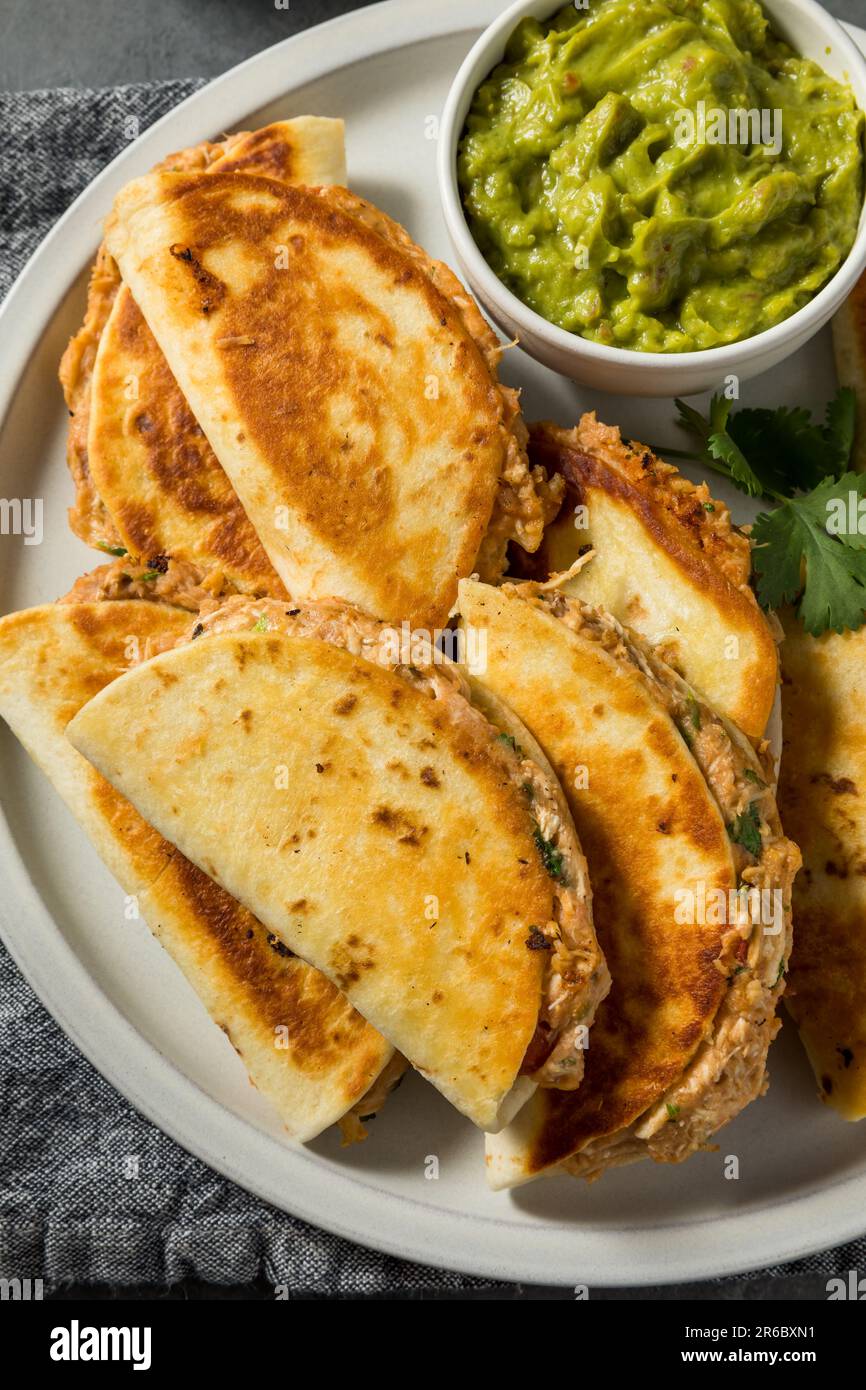 Homemade Mini Chicken Quesadillas with Salsa and Guac Stock Photo - Alamy