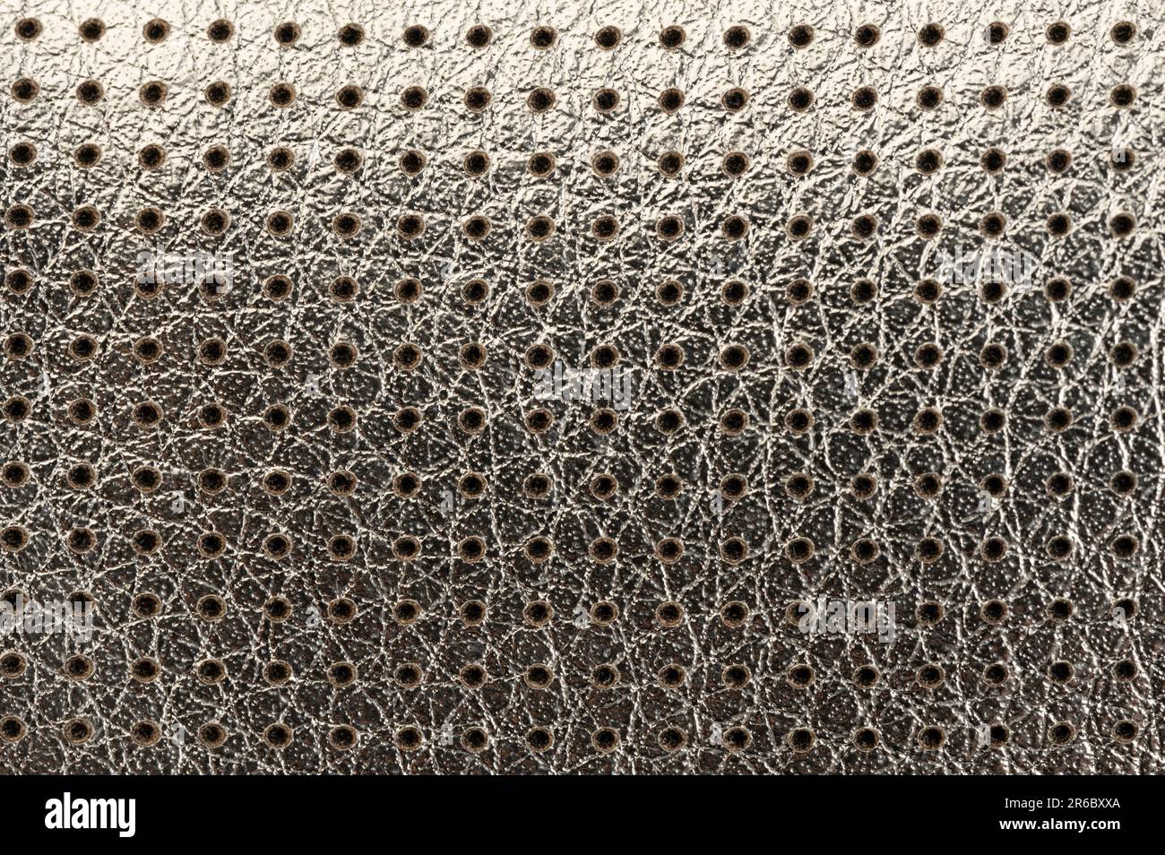 Shiny leather silver color with perforated holes close up view Stock ...