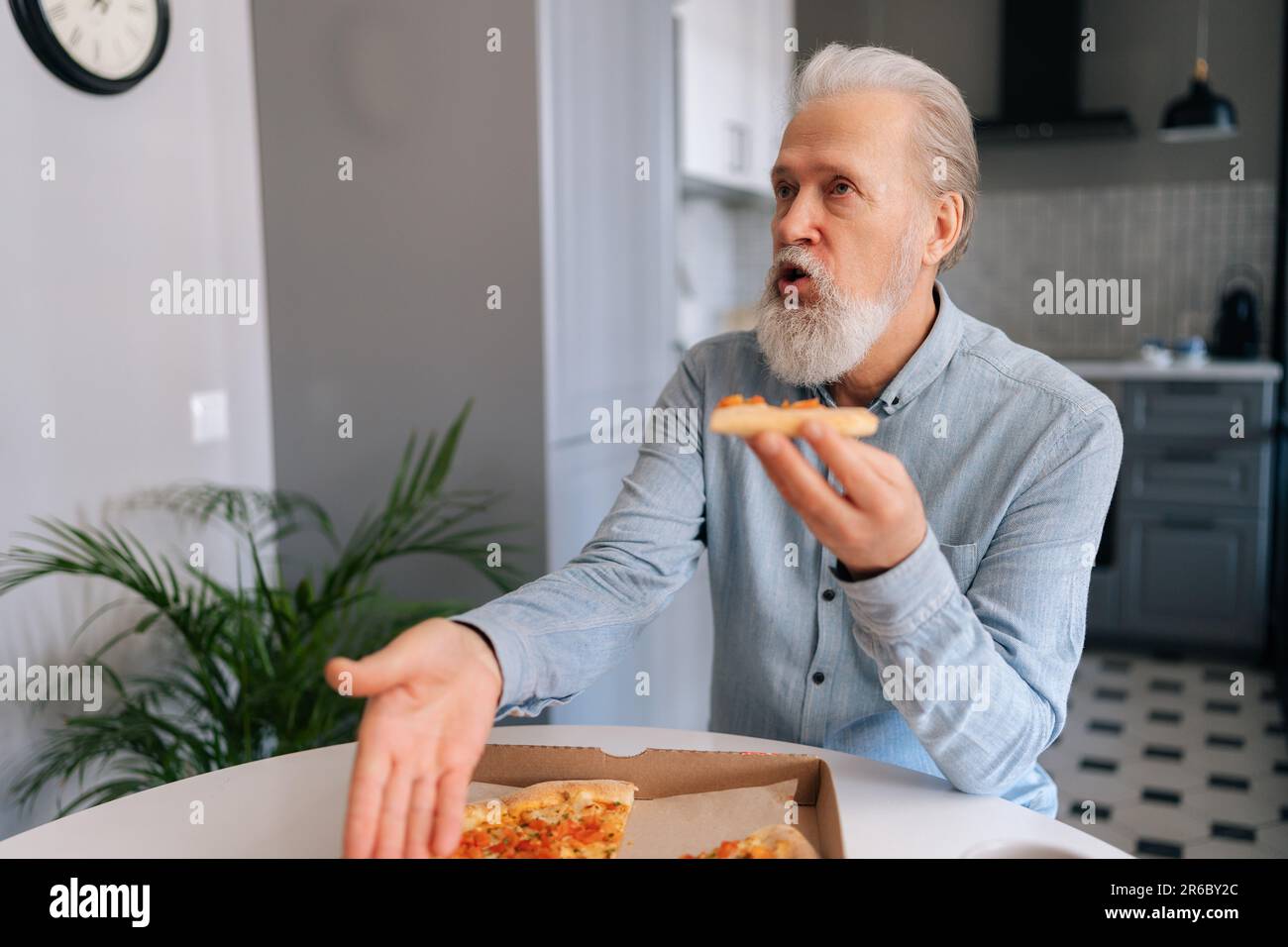 Young caucasian man putting slice hi-res stock photography and images ...
