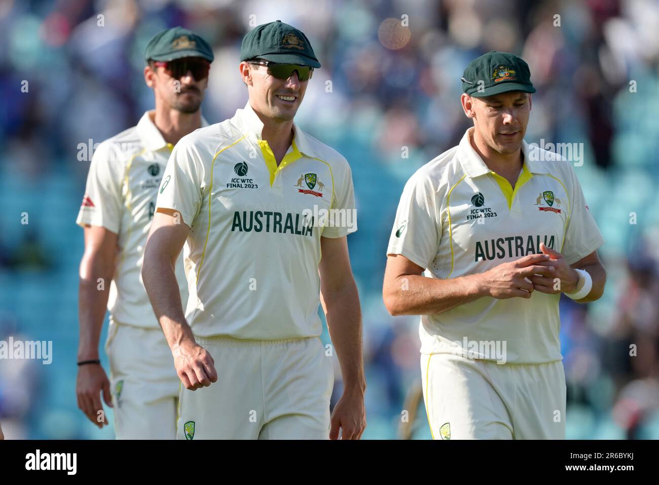 Australia's Pat Cummins, left smiles as he walks off the pitch after ...