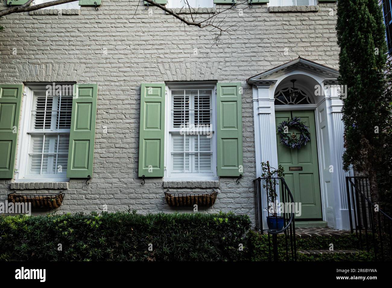 Close up of the color windows of a colonial era home in Charleston ...