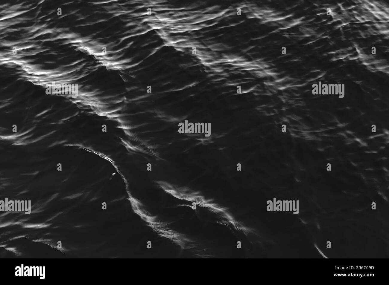 Black water surface with waves. Water ripples. Texture of the water ...