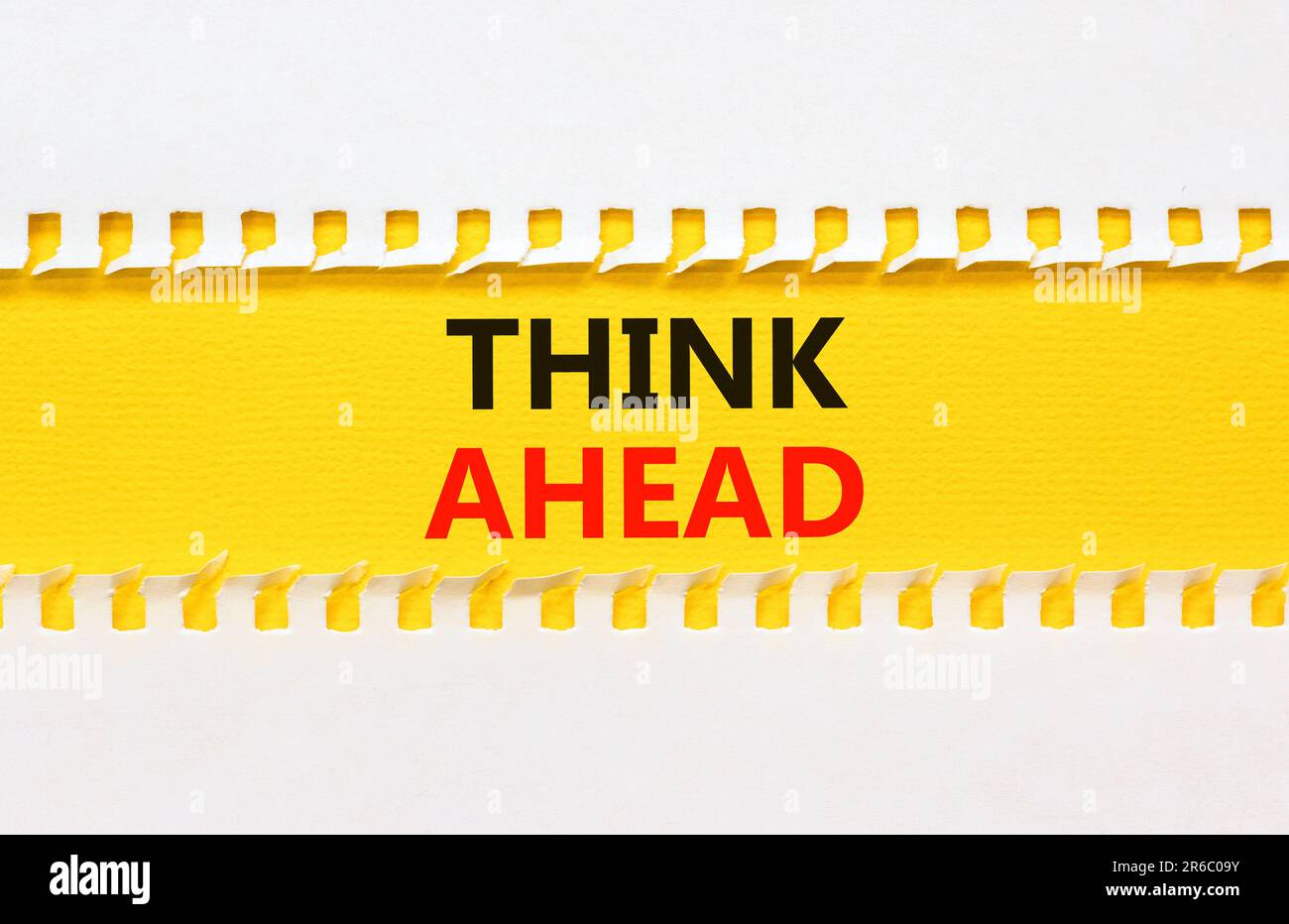 Think ahead symbol. Concept words Think ahead on beautiful yellow paper on beautiful white ...