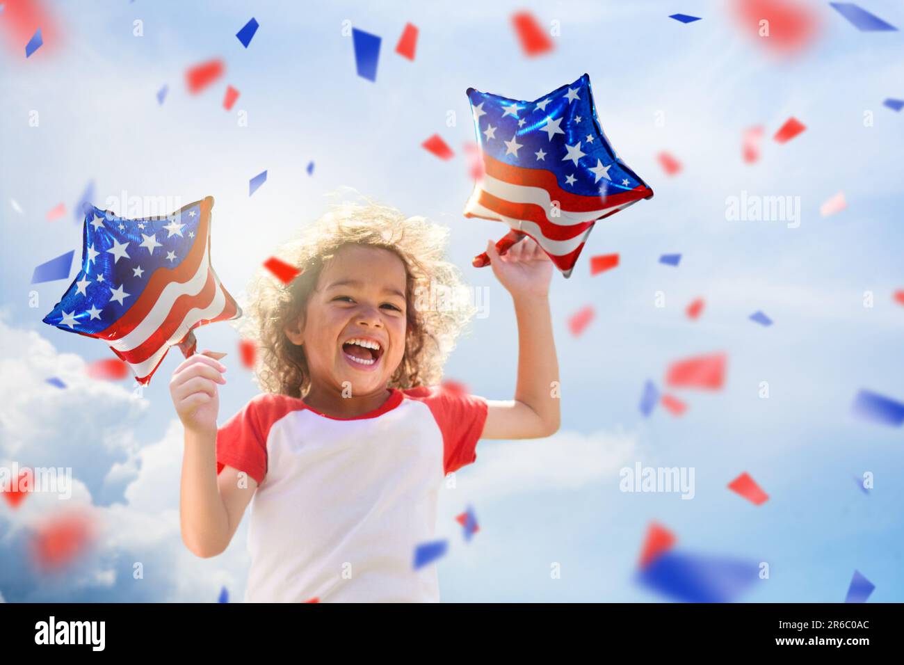 American family celebrating 4th of July. Laughing happy child watching ...