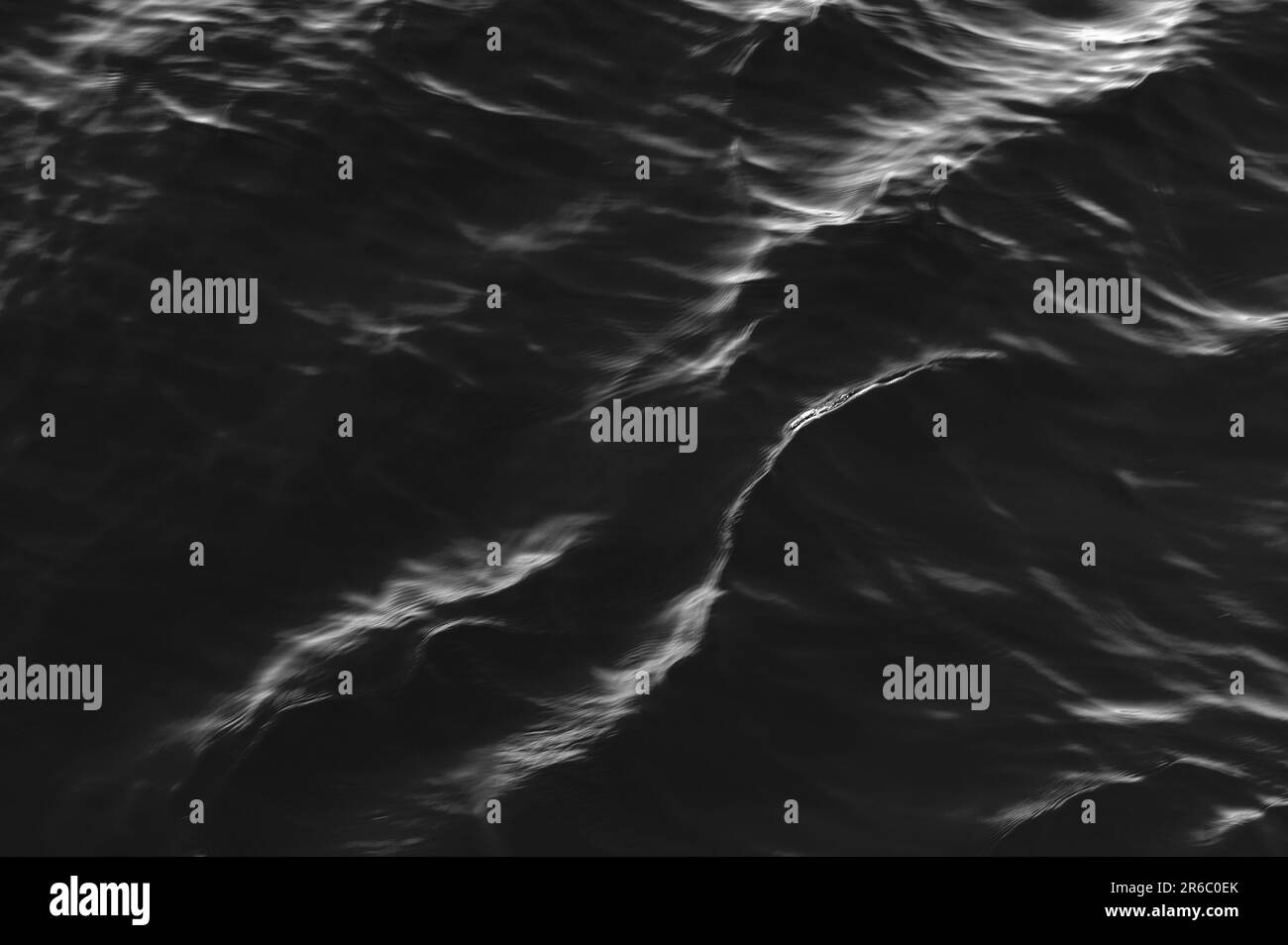 Black water surface with waves. Water ripples. Texture of the water ...